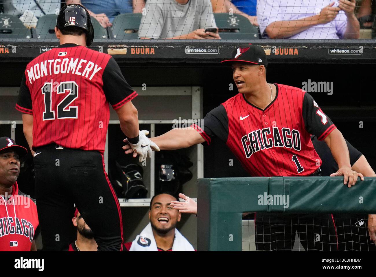 Chicago White Sox manager Will Venable (1), right, slaps hands with ...