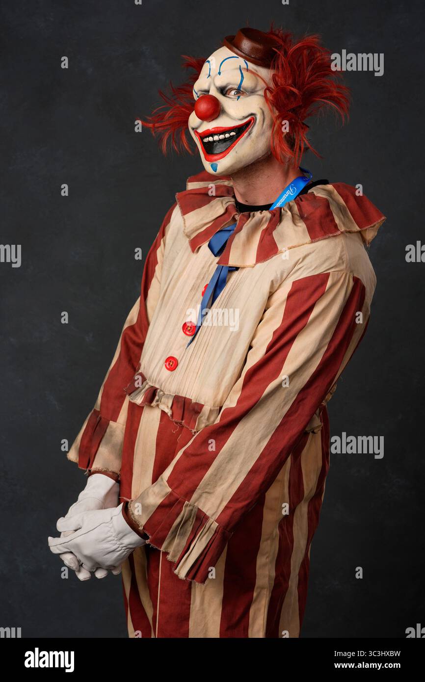 A person dressed as the character Frendo the clown poses for a portrait ...