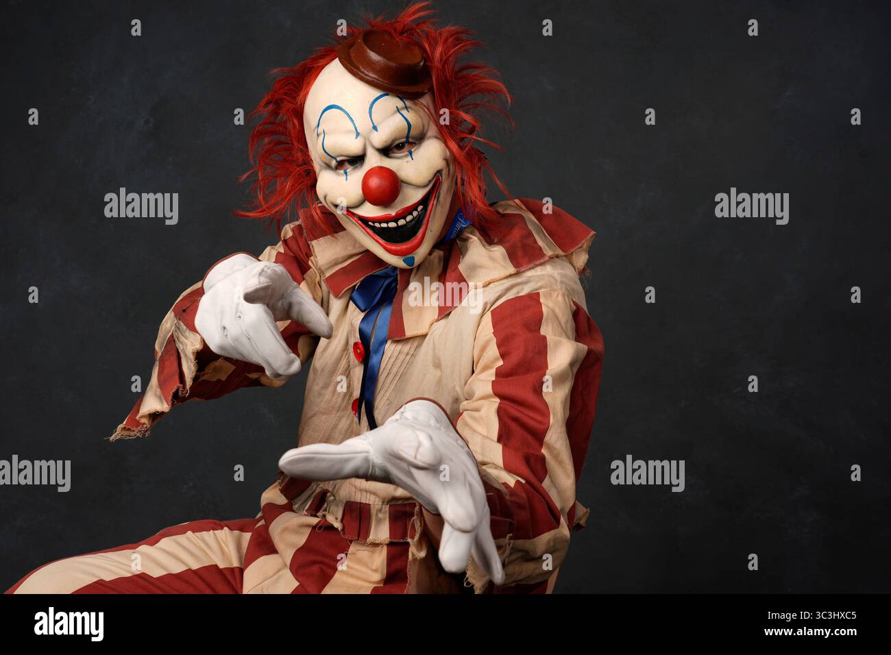 A person dressed as the character Frendo the clown poses for a portrait ...