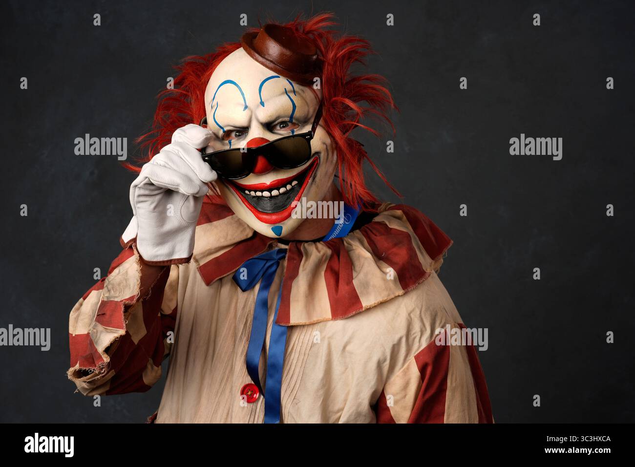 A person dressed as the character Frendo the clown poses for a portrait ...