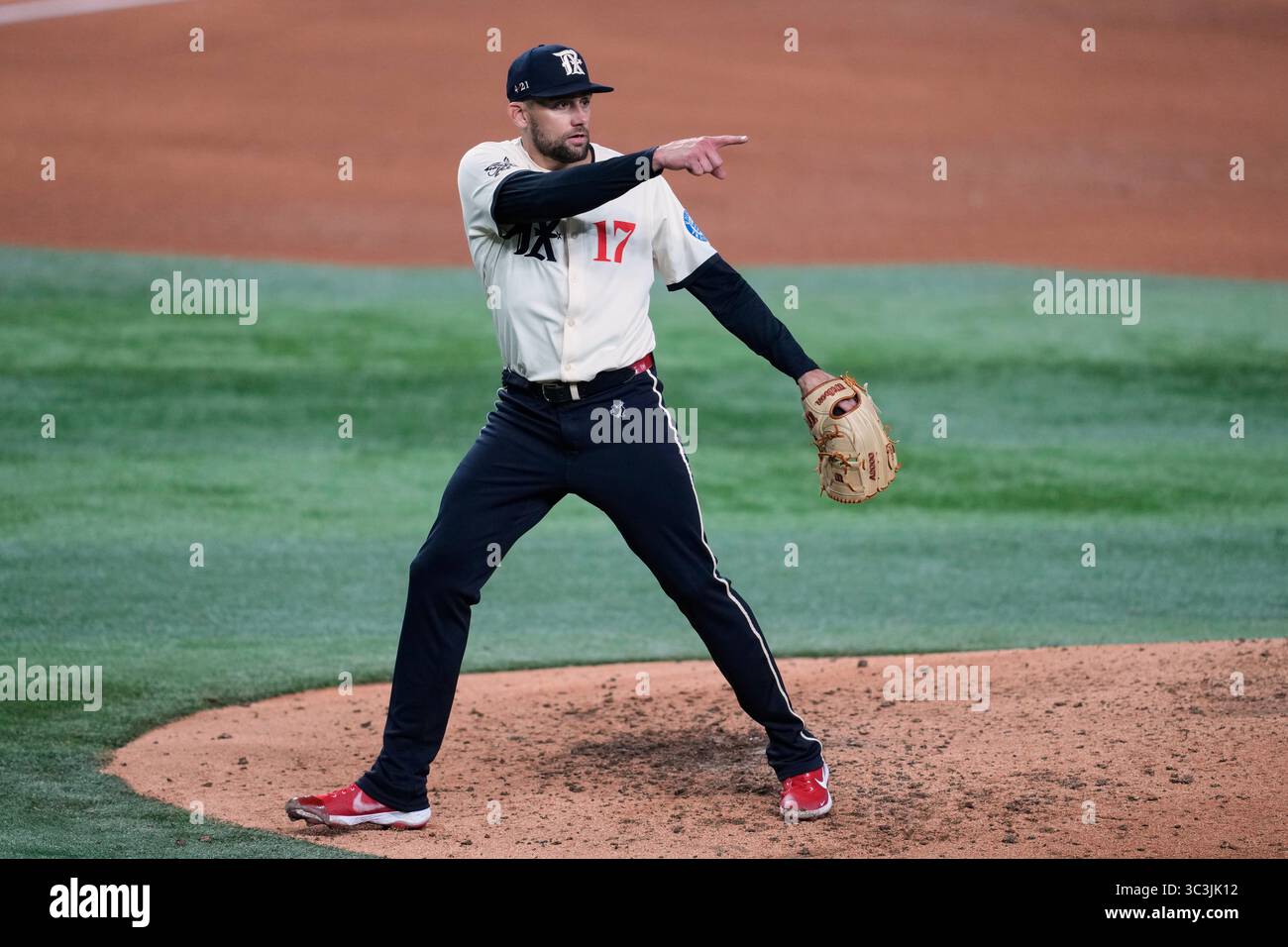 Texas Rangers starting pitcher Nathan Eovaldi looks for an umpire's ...