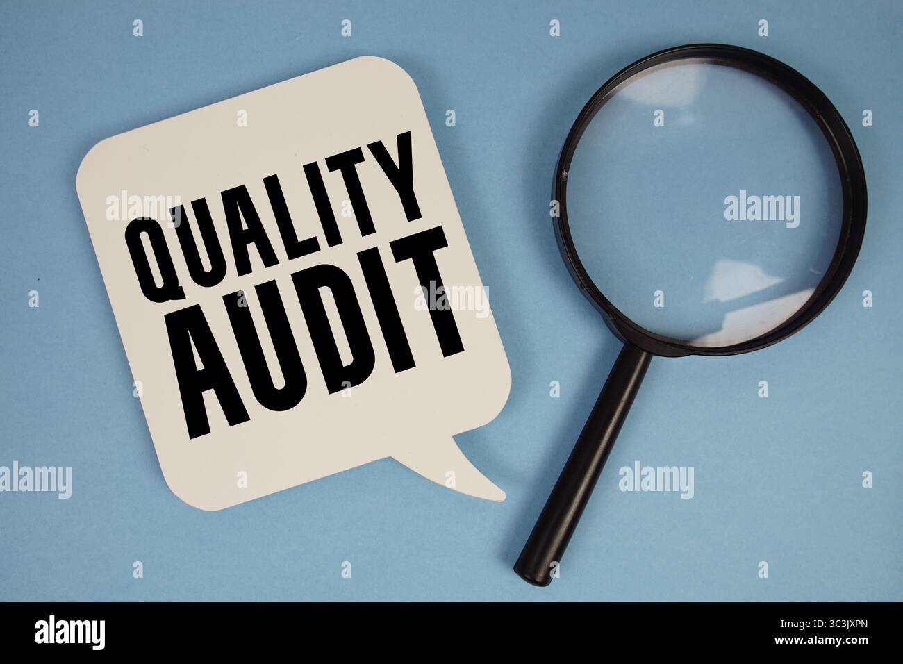 Quality Audit text with magnifying glass on blue background Stock Photo ...