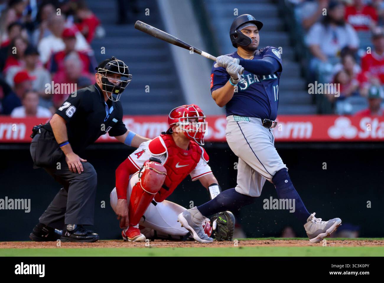 Seattle Mariners' Josh Naylor (12) hits a pitch during the third inning ...