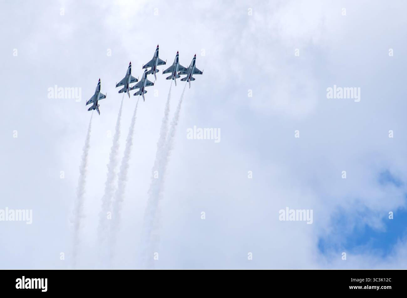 Six United States Air Force Thunderbirds perform a vertical arrowhead ...