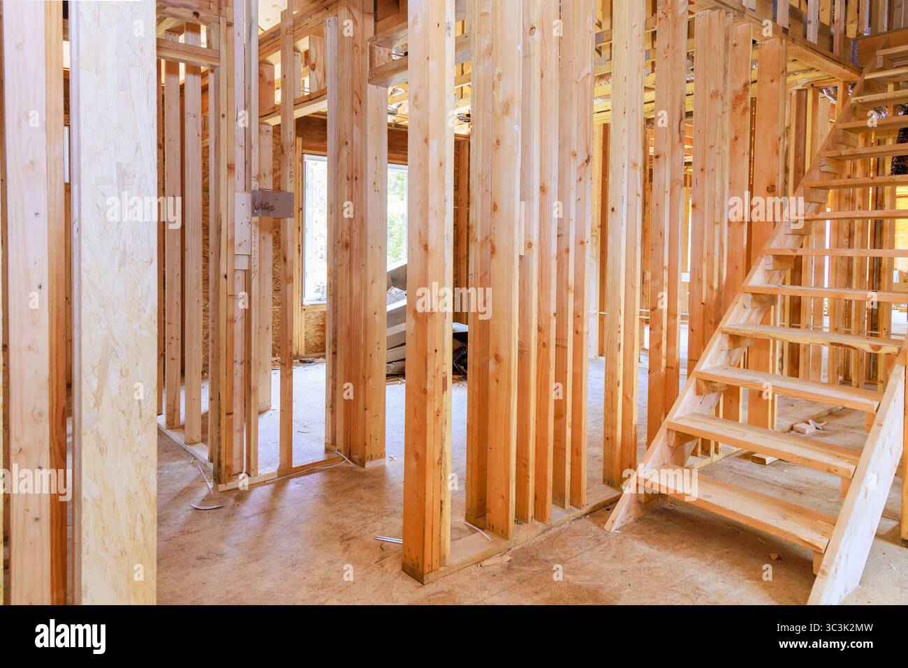 Construction site featuring wooden framing, clear spaces, stairs under ...