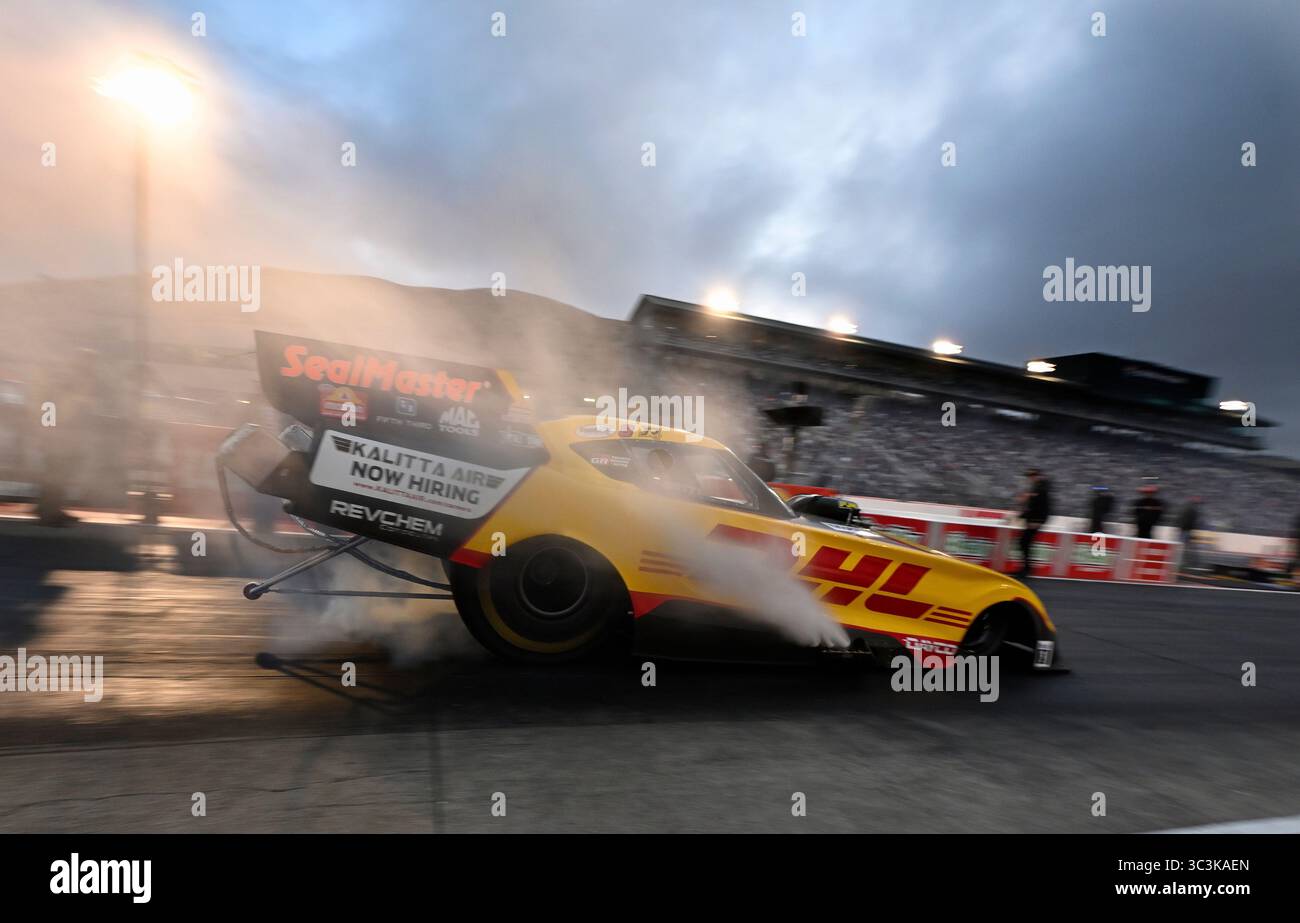 SONOMA, CA - JULY 25: Funny Car driver J.R. Todd does his burnout ...