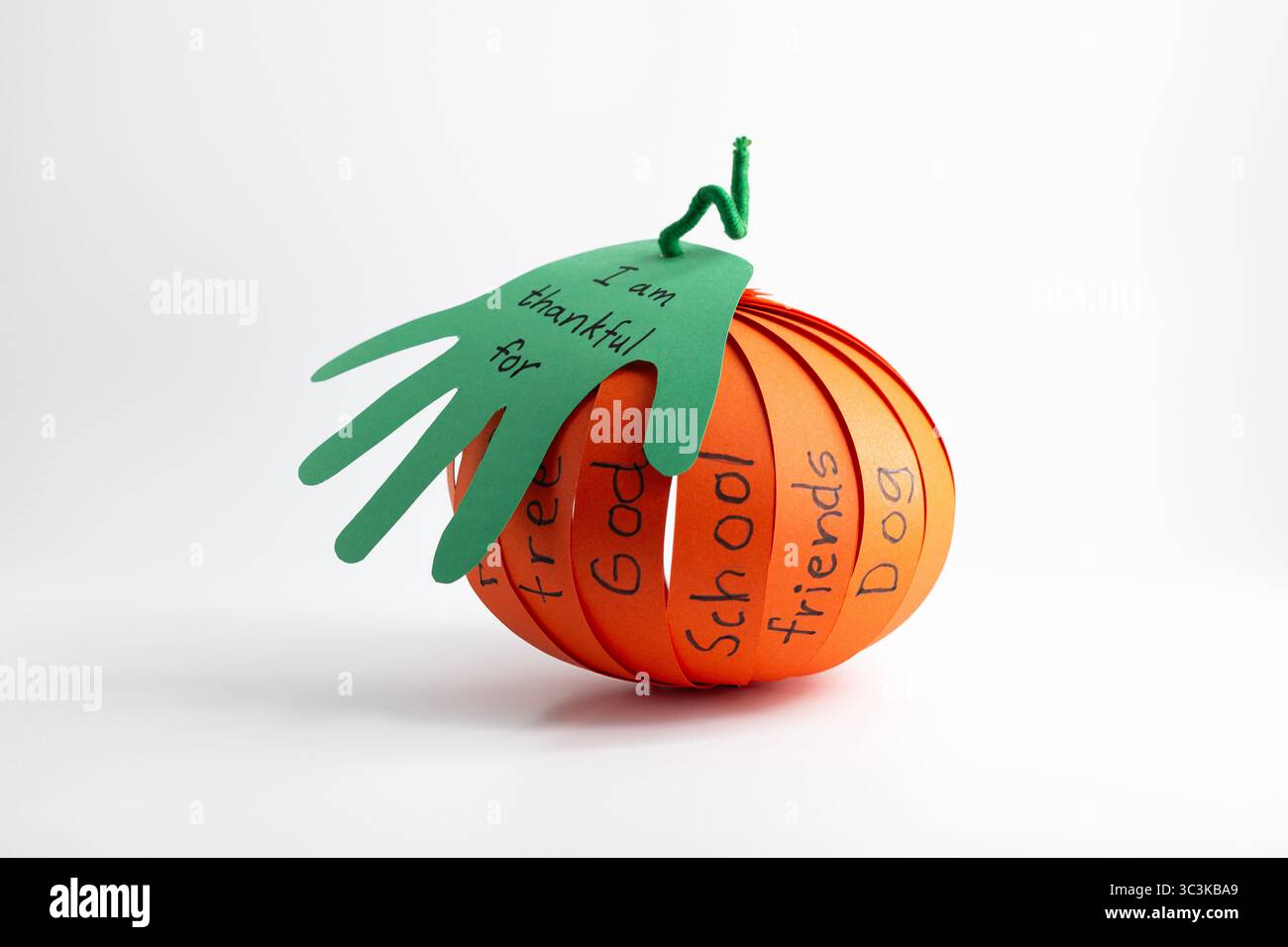 Pumpkin made up of paper strips, Eye level shot of a crafted pumpkin ...
