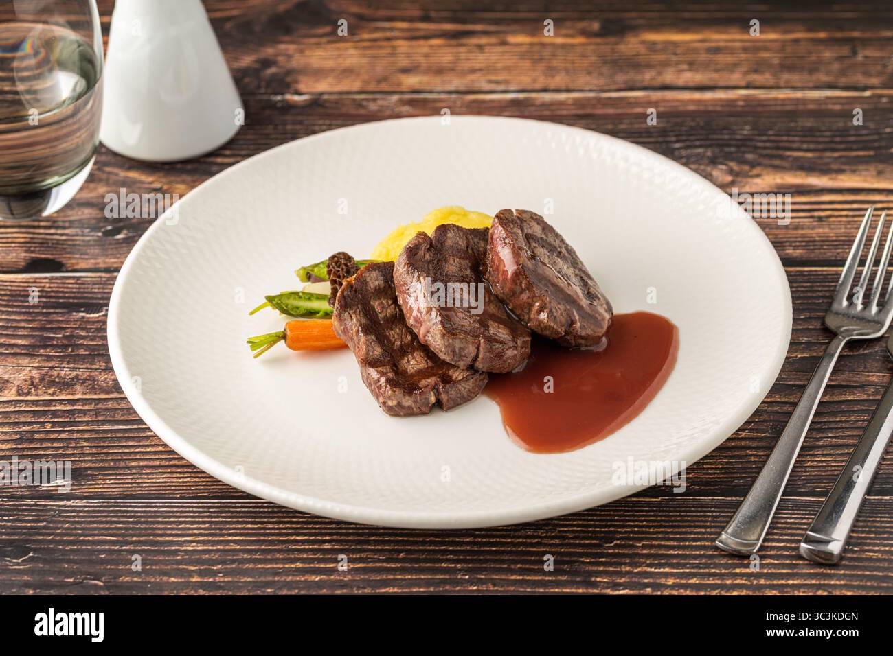 Juicy grilled filet medallions served with seasonal vegetables and ...
