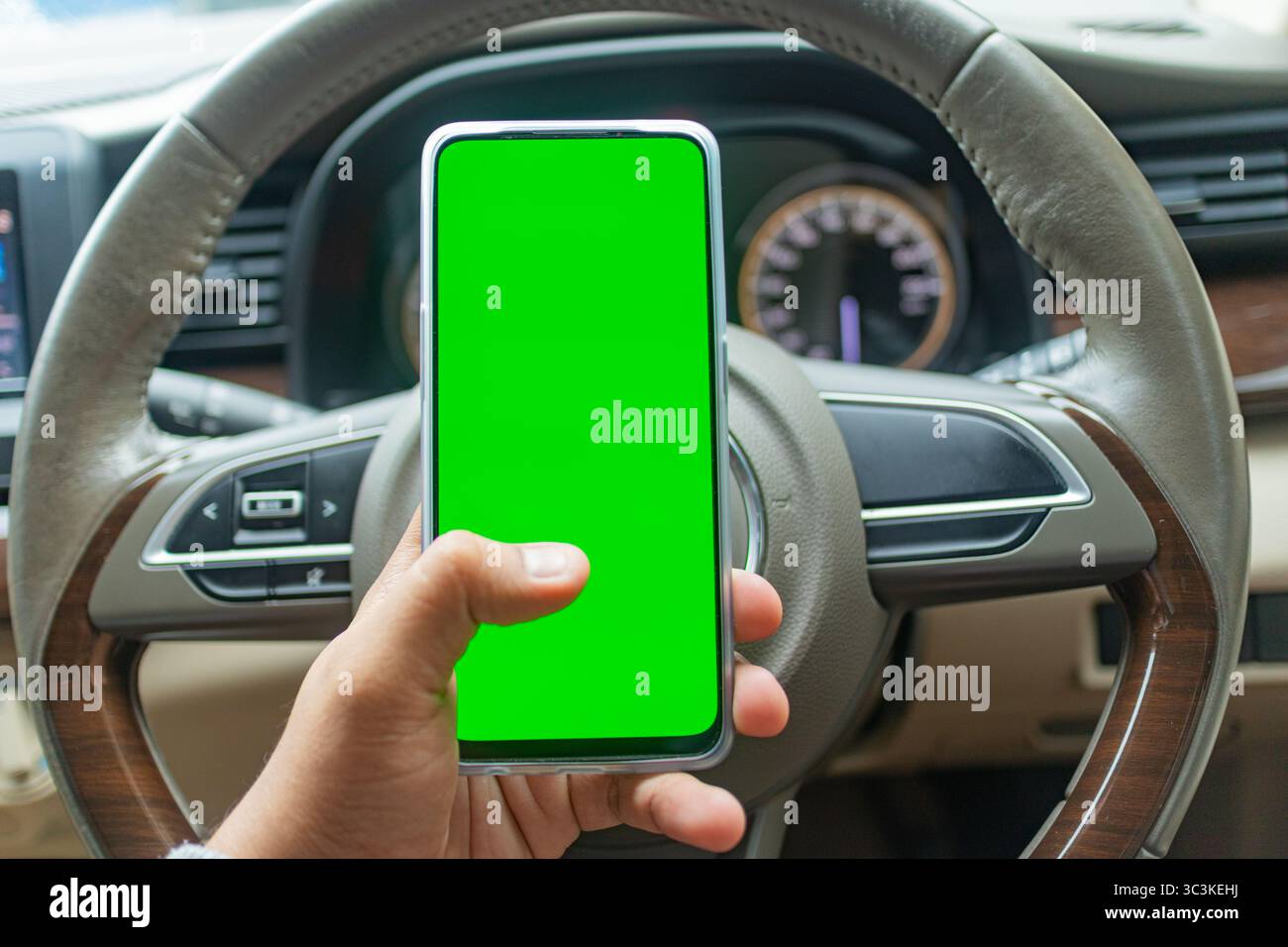 Vertical Green Screen Smartphone Held Near Car Steering Wheel Stock ...