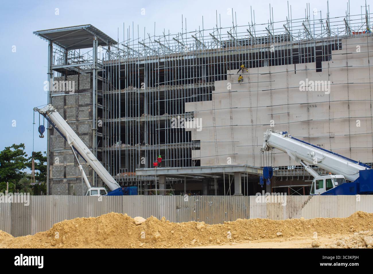 A multi-story building under construction with exposed steel framing ...