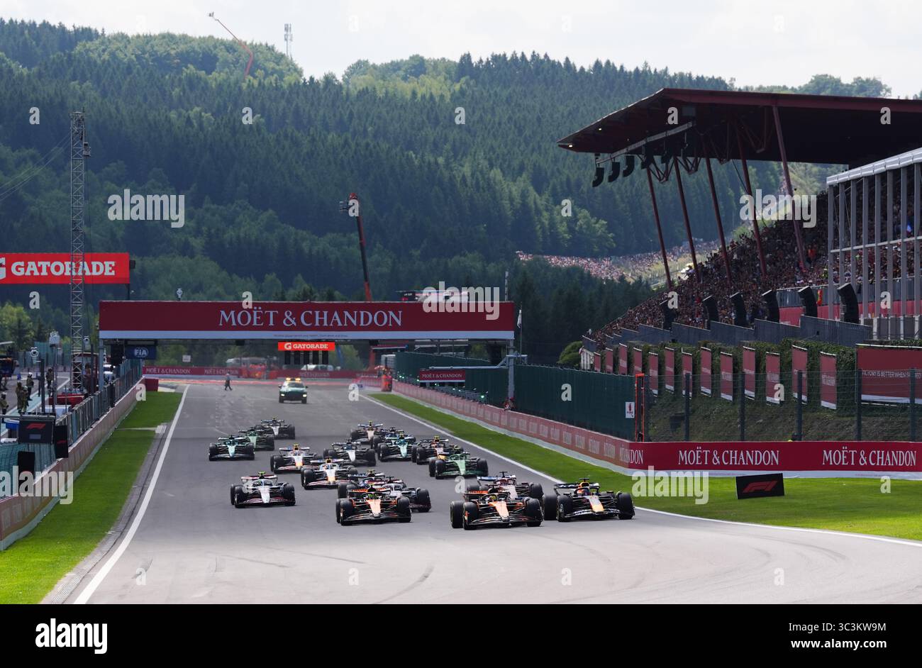McLaren driver Oscar Piastri leads Red Bull driver Max Verstappen into ...