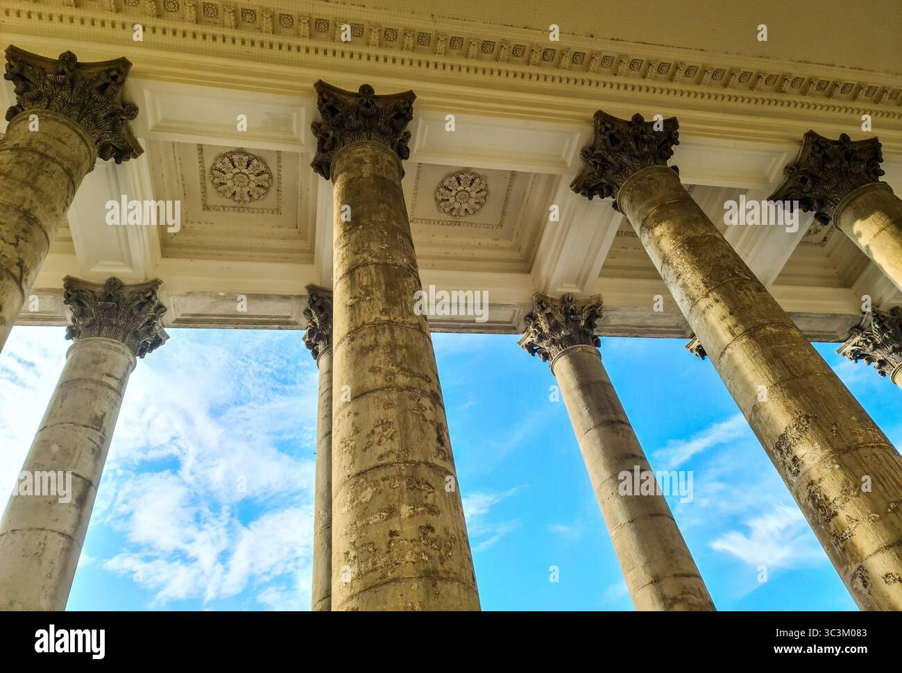 Fluted columns supporting an ornate ceiling reach towards a vibrant ...
