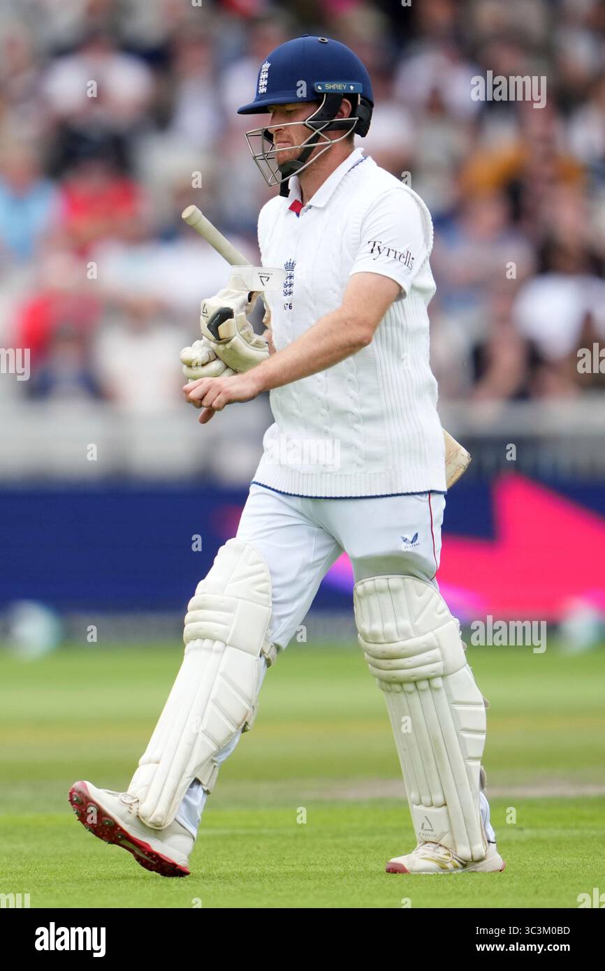 England's Liam Dawson walks off the field after losing his wicket on ...