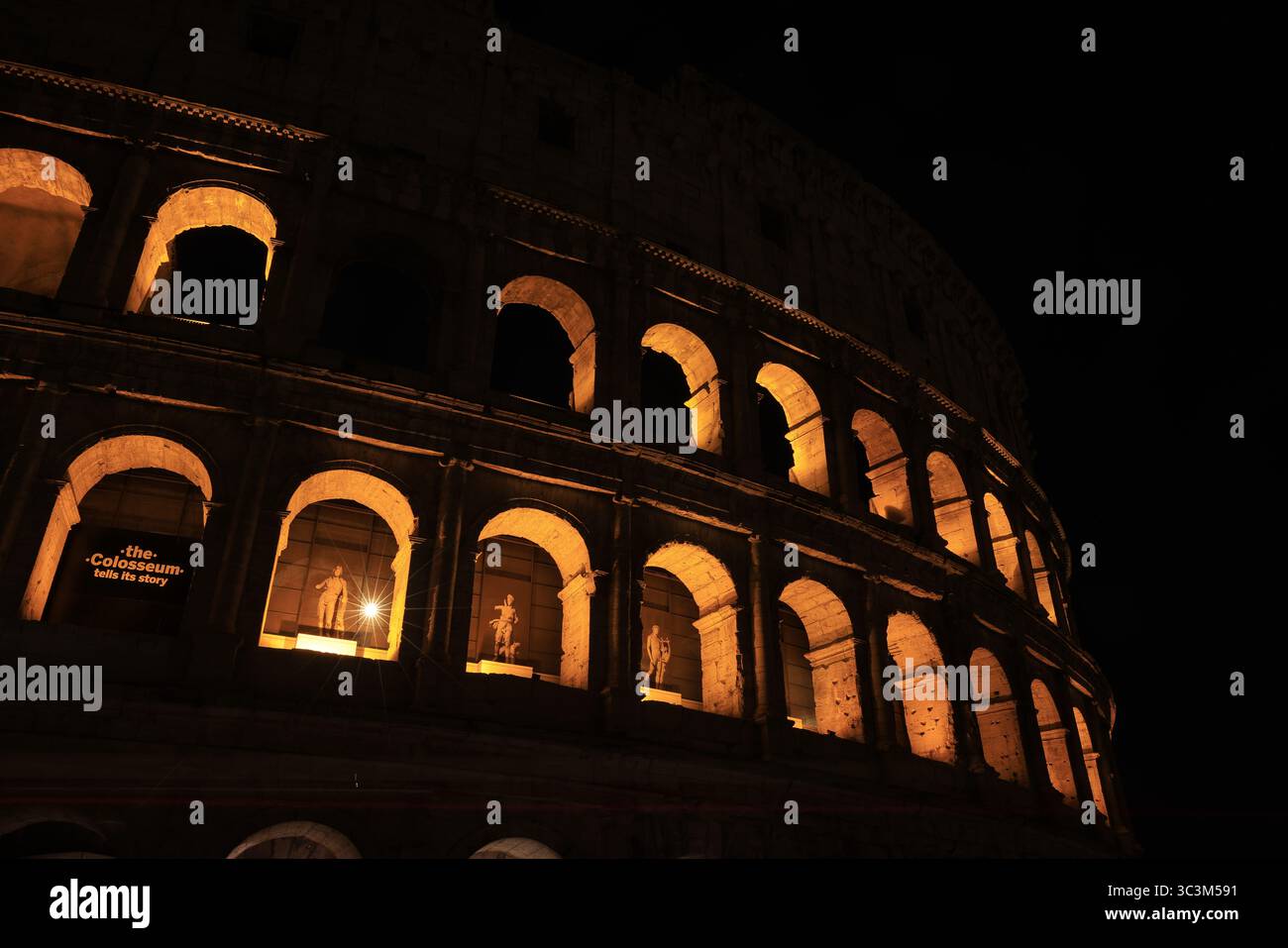 The Colosseum in Rome, Italy, lit up at night. A symbol of ancient Rome and one of the most ...