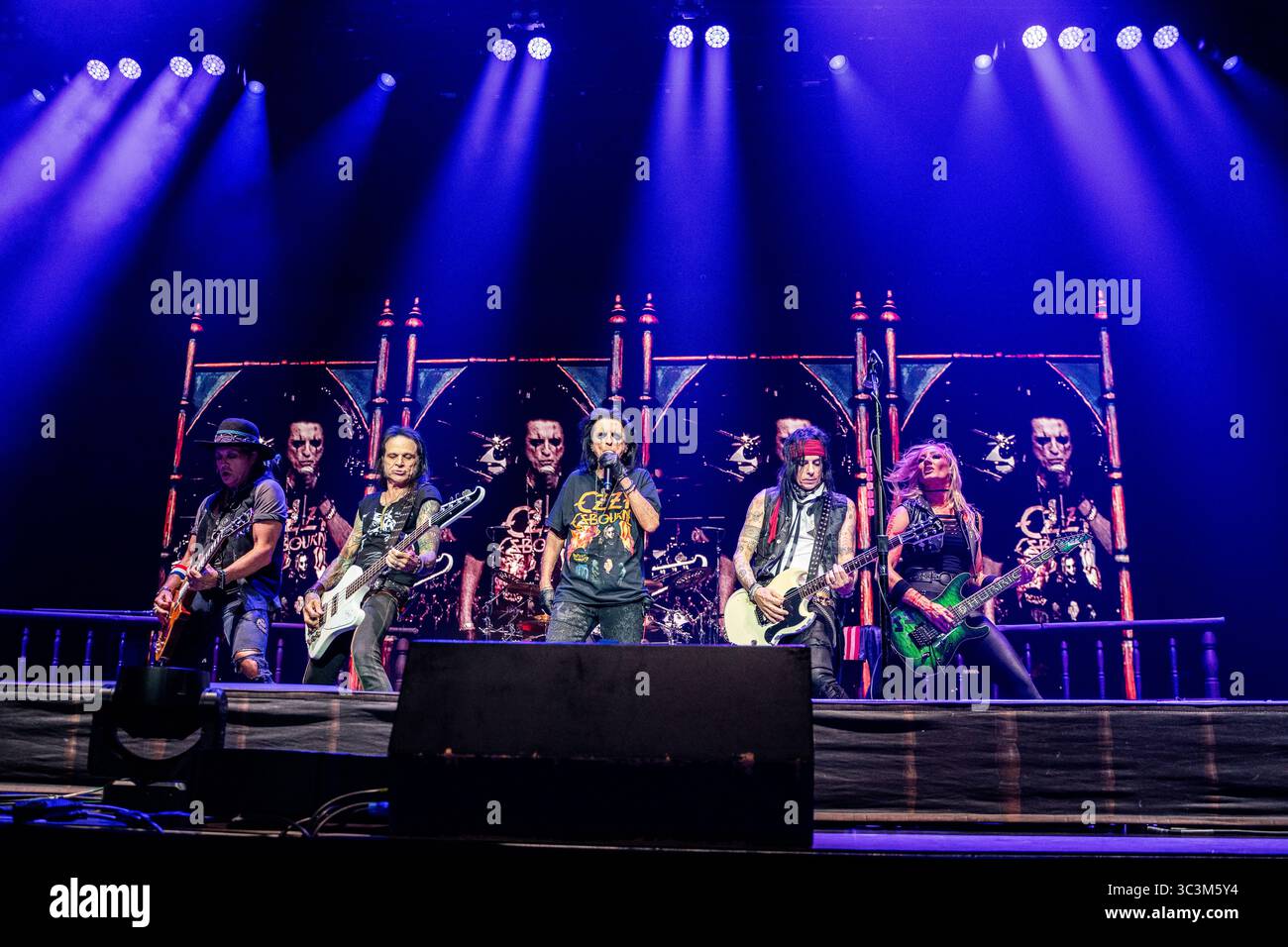 Alice Cooper seen on stage with his touring band members Ryan Roxie ...