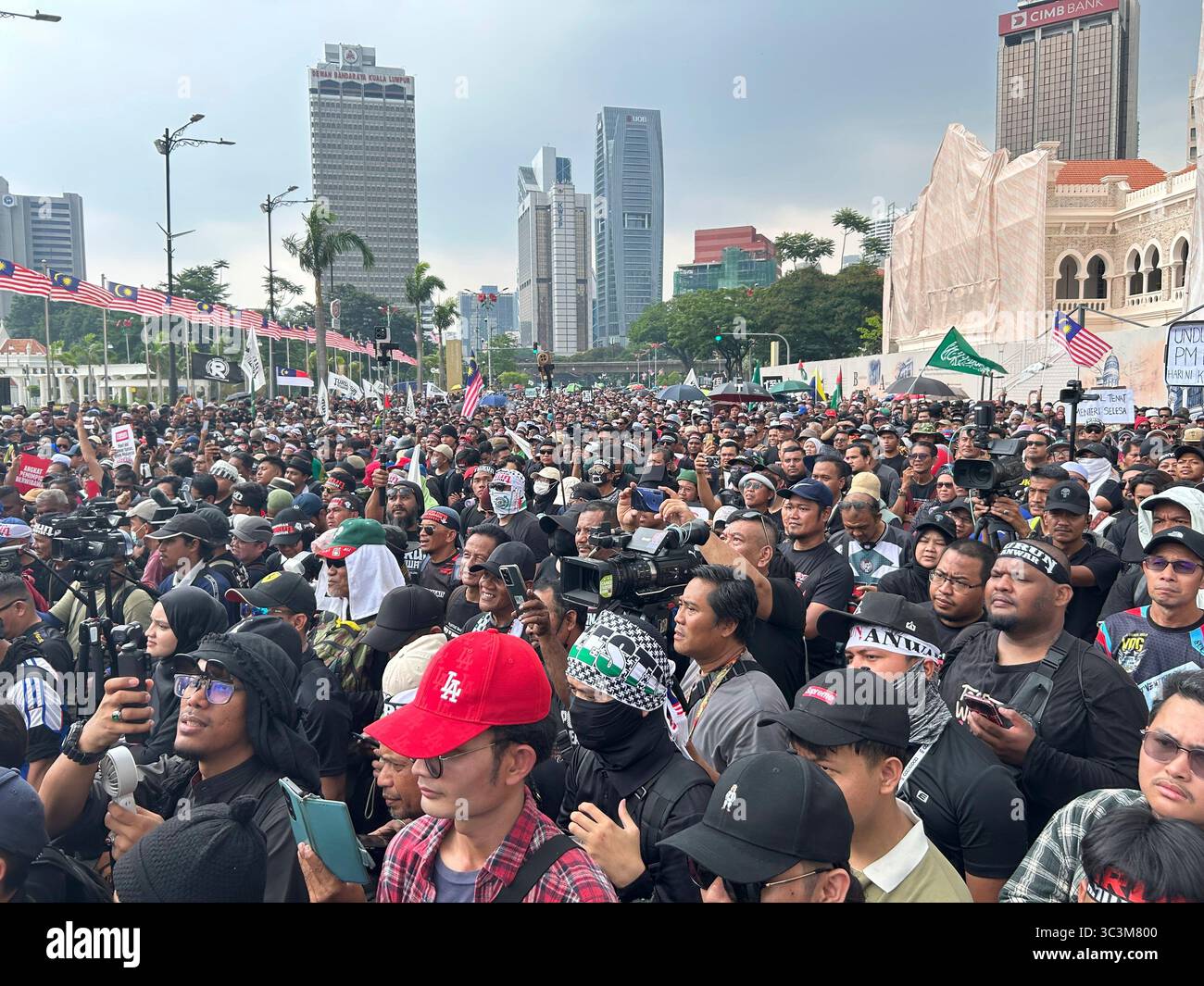 Supporters of Malaysia's opposition coalition gather for a rally demanding the resignation of ...