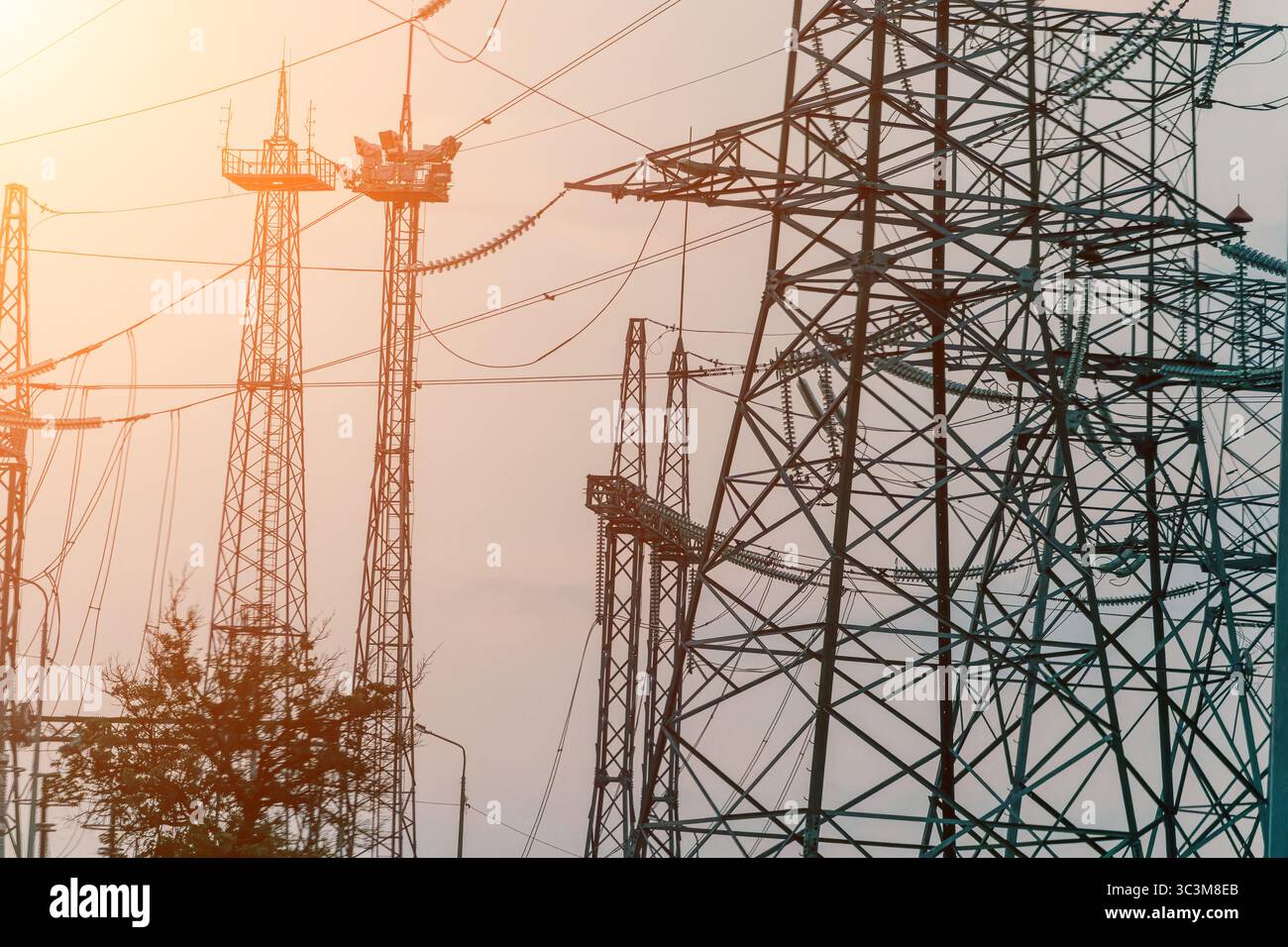 High voltage electric distribution network at sunset. Power ...