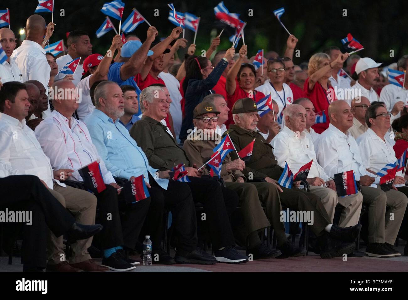 Former Cuban President Raul Castro, center, President Miguel Diaz-Canel ...