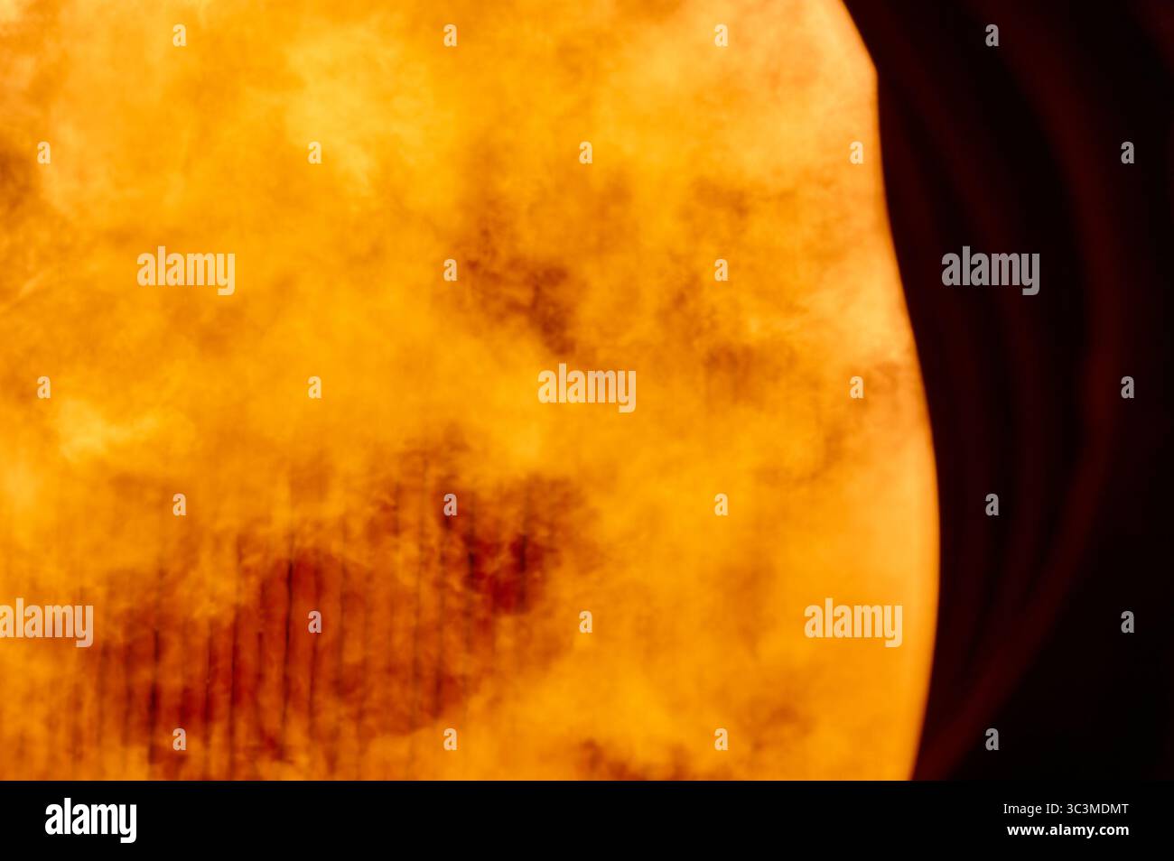 Intense combustion flames inside a steam boiler furnace at a thermal ...