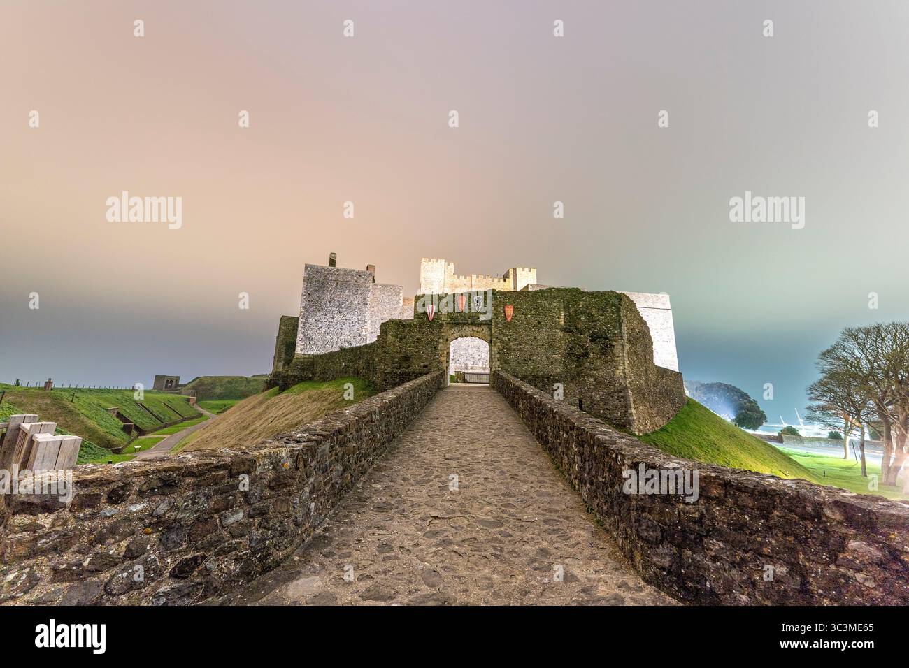 King's gate, Dover castle at night. The stone bridge to the gate and ...