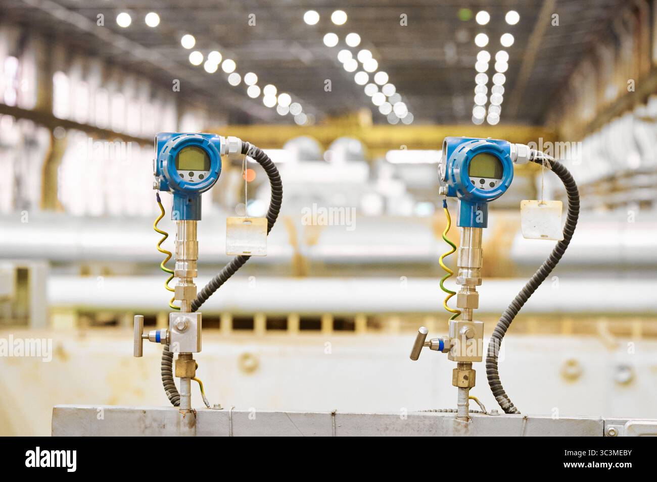 Electronic temperature sensors in a manufacturing facility showing ...