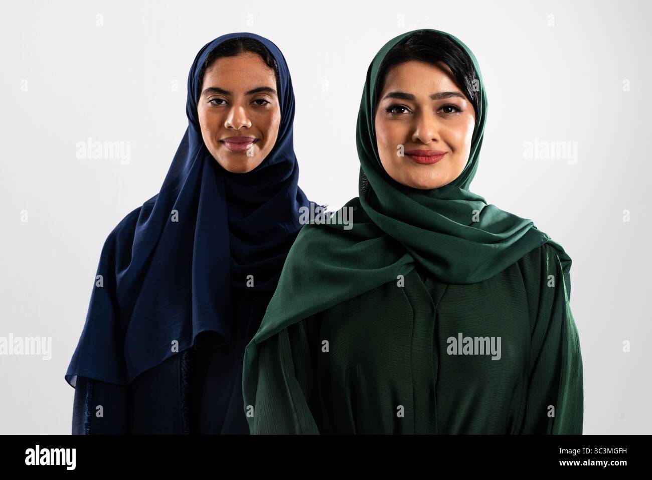 Studio portrait of two confident middle eastern businesswomen wearing ...
