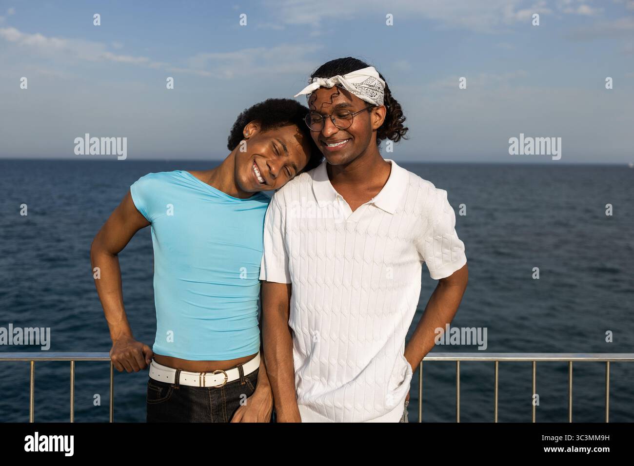Joyful queer couple standing hi-res stock photography and images - Alamy