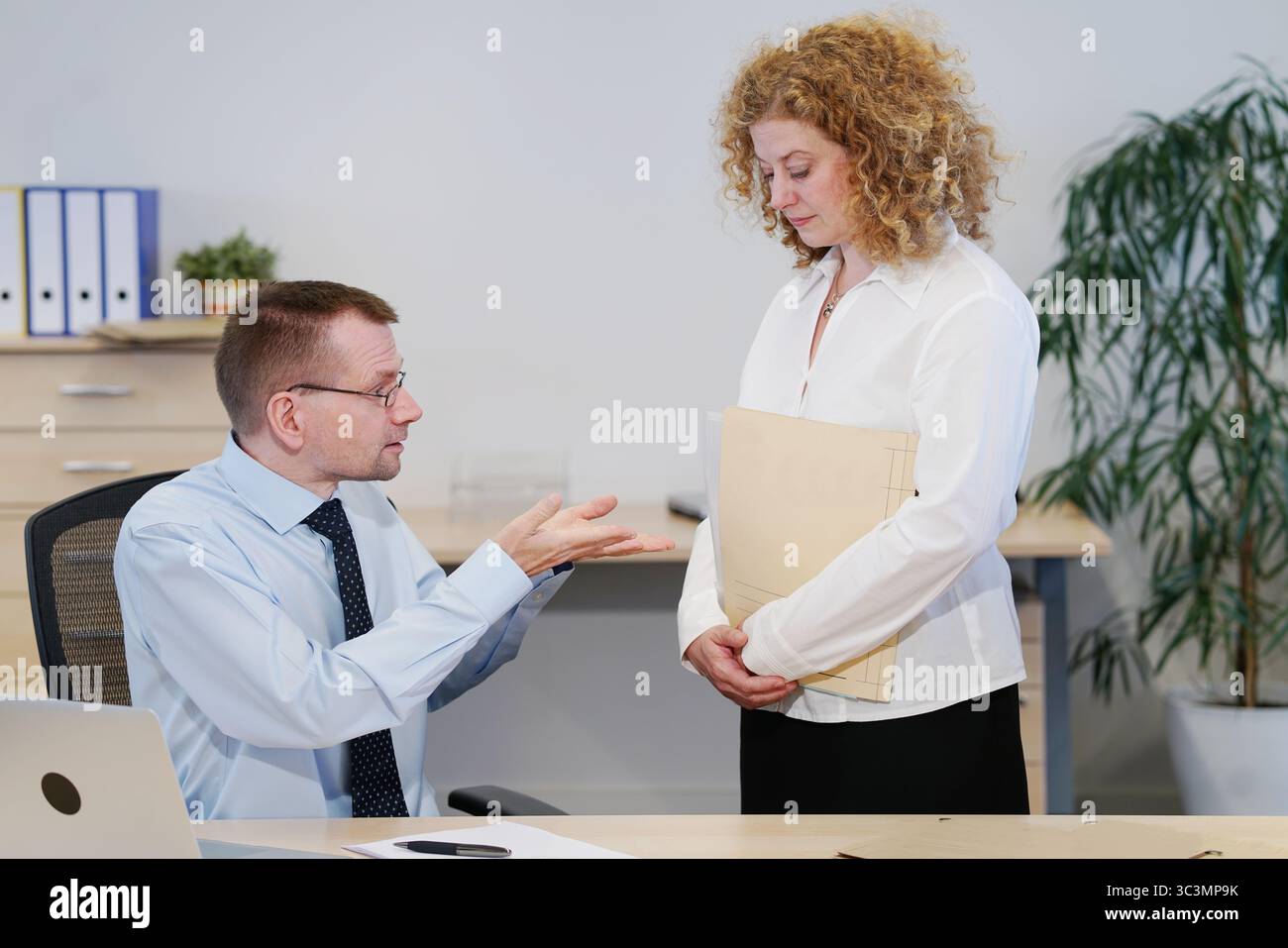 Boss is very dissatisfied with his secretary and insults her, she looks ...