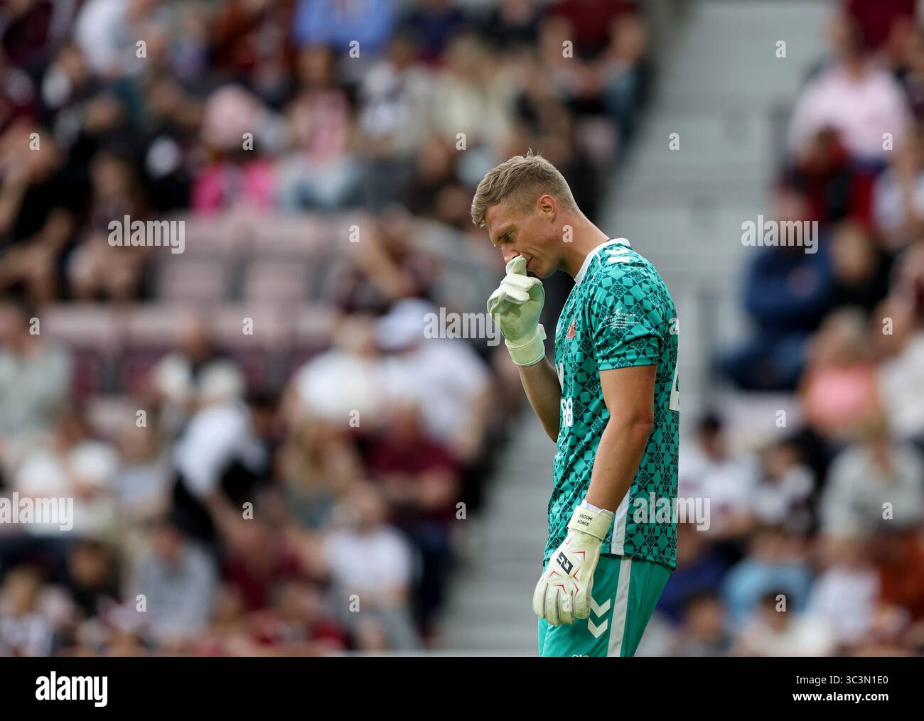 Sunderland goalkeeper Simon Moore reacts after conceding a goal during ...