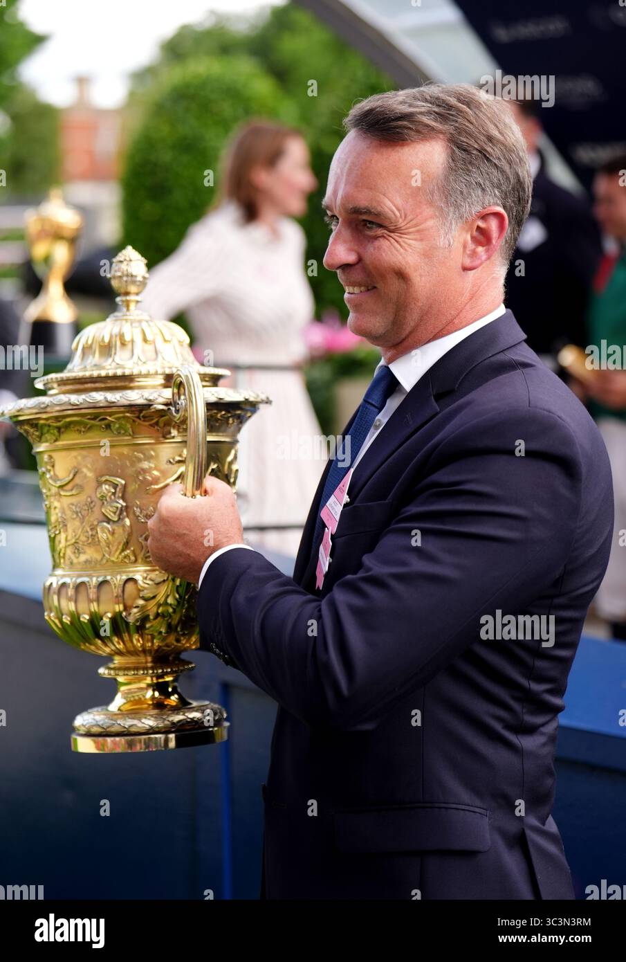 Trainer Francis Henri Graffard with the trophy after Calandagan won the ...