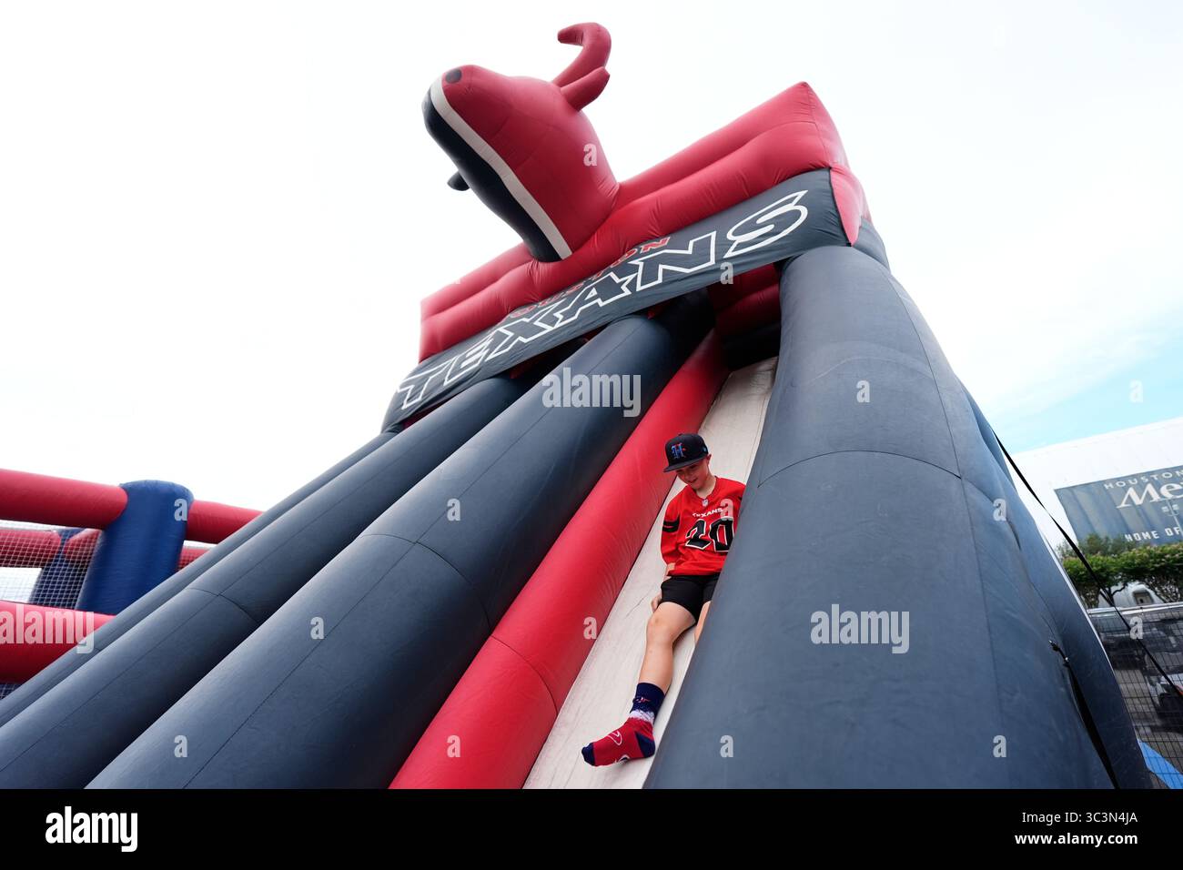 Cameron Pullen, 9, slides during Back Together Weekend at the Houston ...