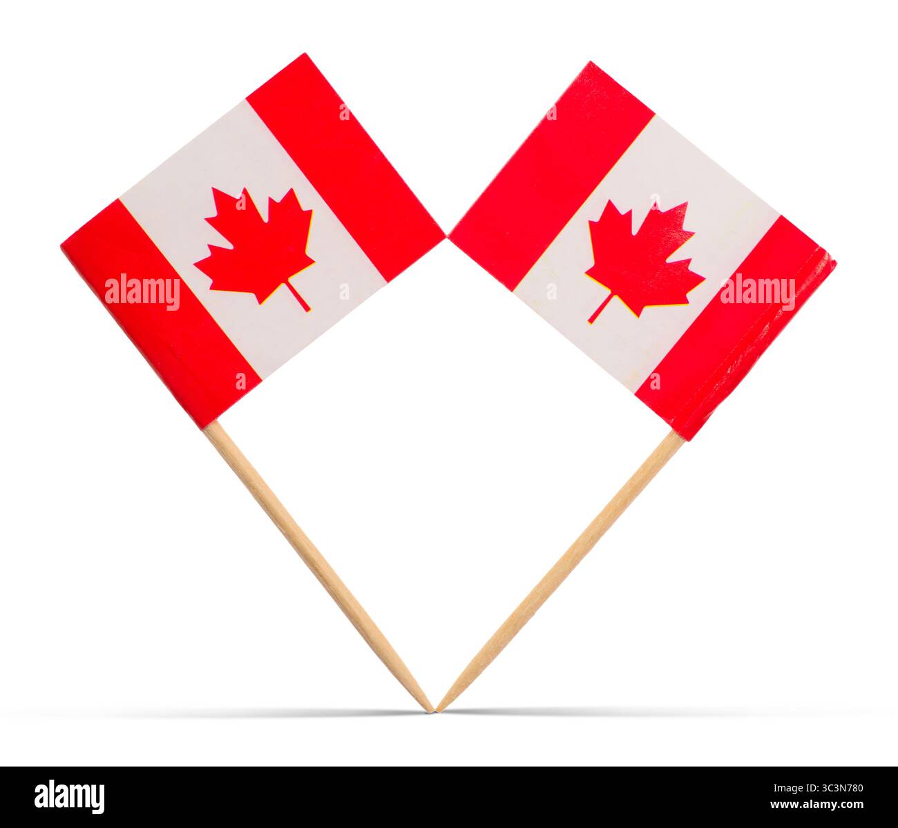 Small paper flags of Canada on white background Stock Photo - Alamy