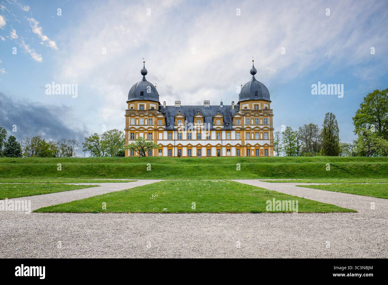 The historic Seehof Palace Park with the palace at sunset. Landscape ...