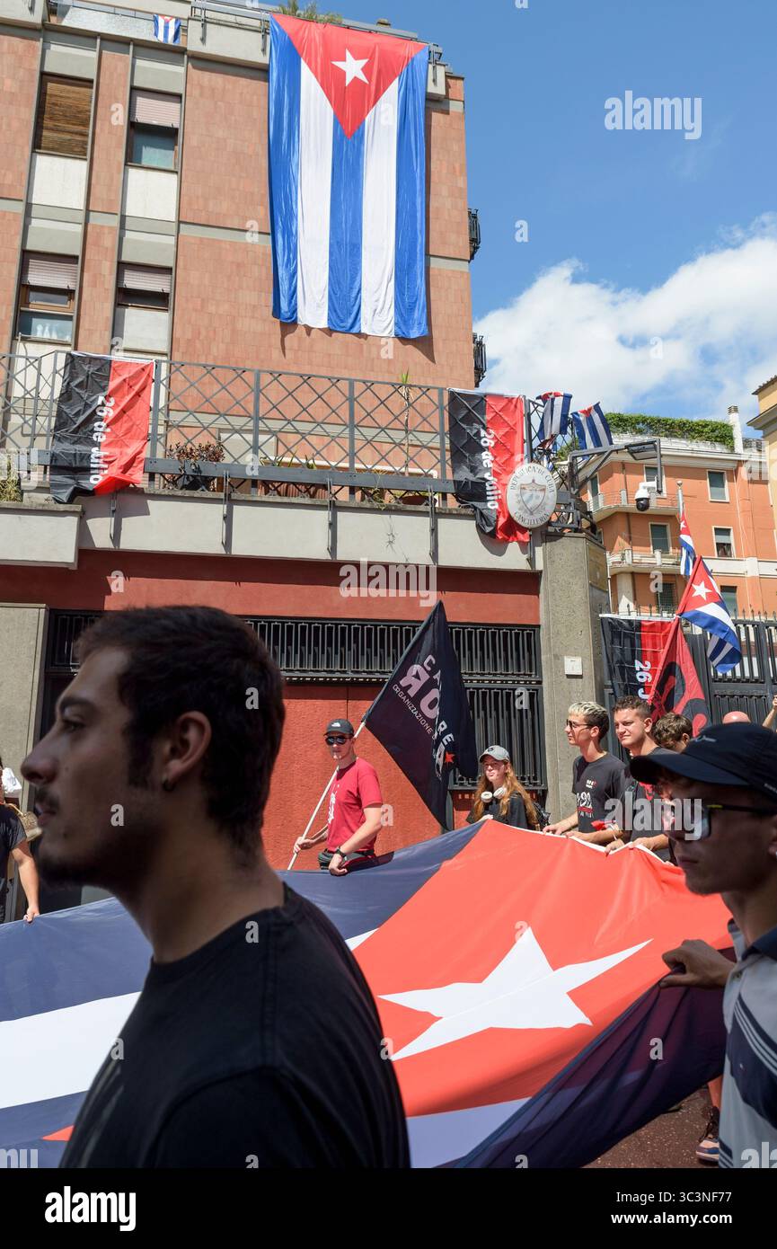 July 26, 2025, Rome, Italy: Cubans and sympathizers carry a large Cuban ...