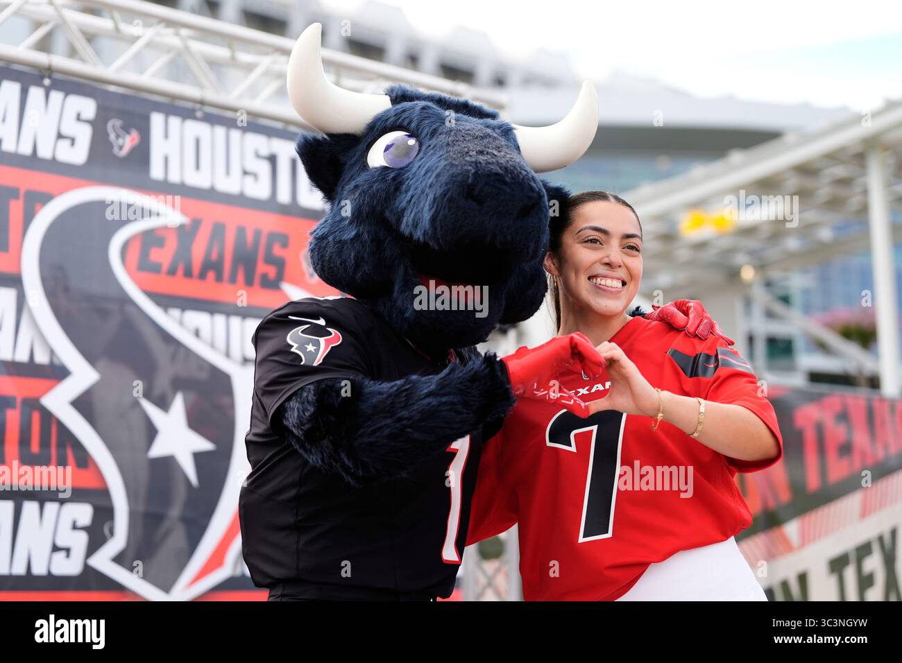 Julianna Ventura, right, poses with Houston Texans mascot Toro during ...
