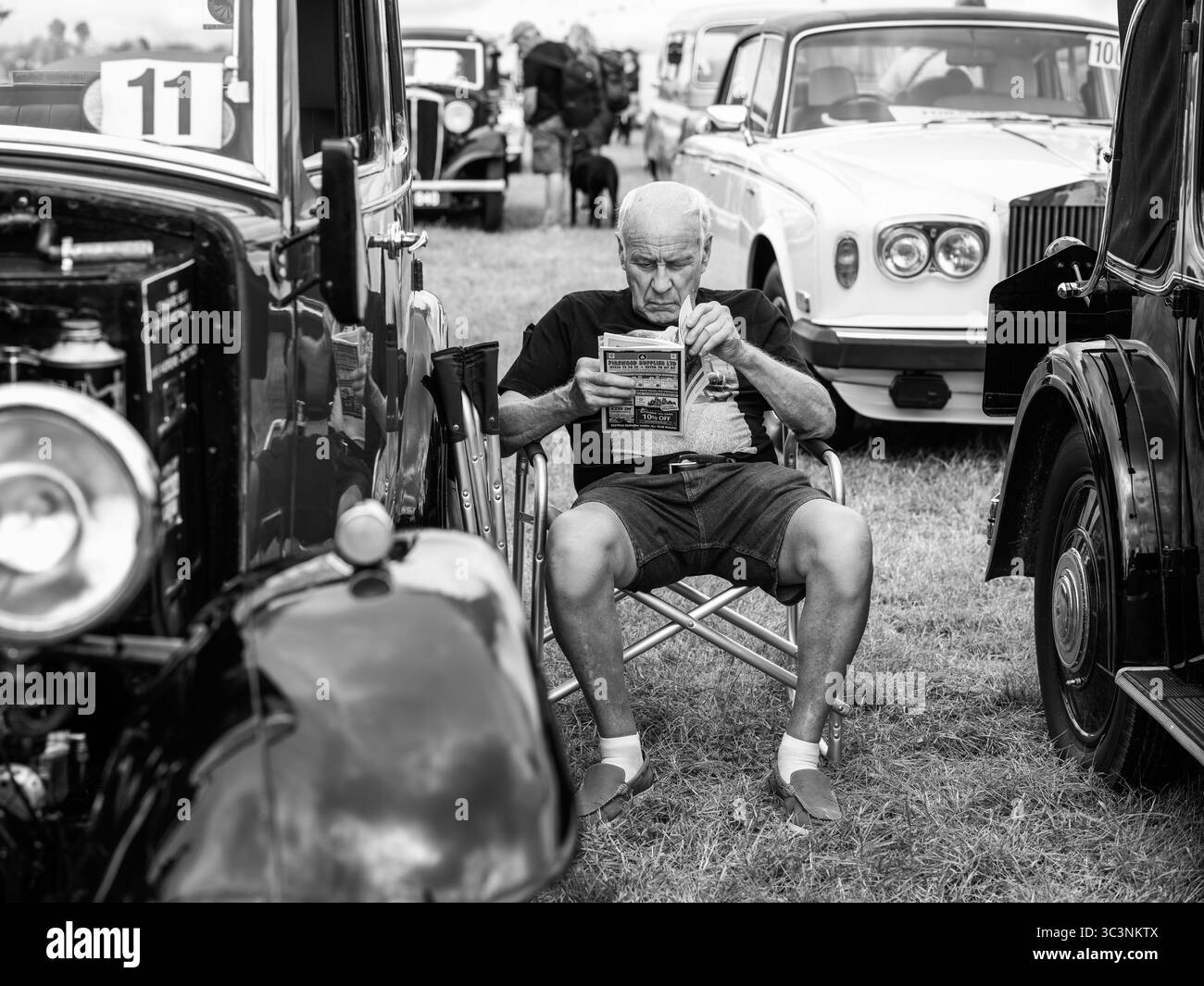 Man sitting reading a mazine at St Buryan Show 26th July 2025 Cornish ...
