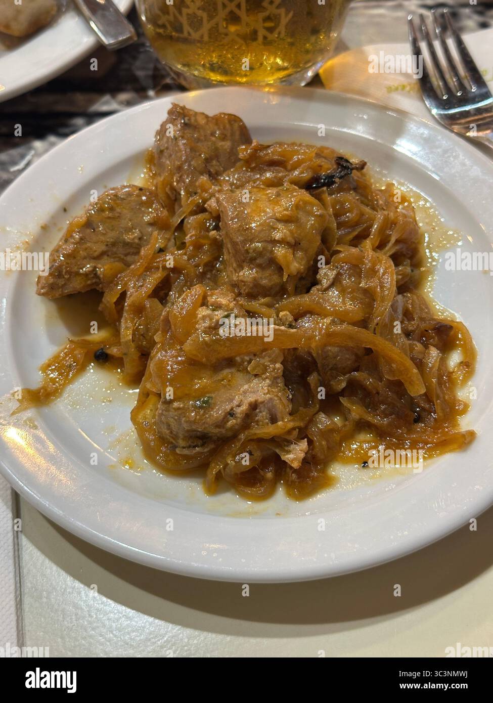 Tuna fish in onion sauce, traditional spanish food in Costa del Sol ...