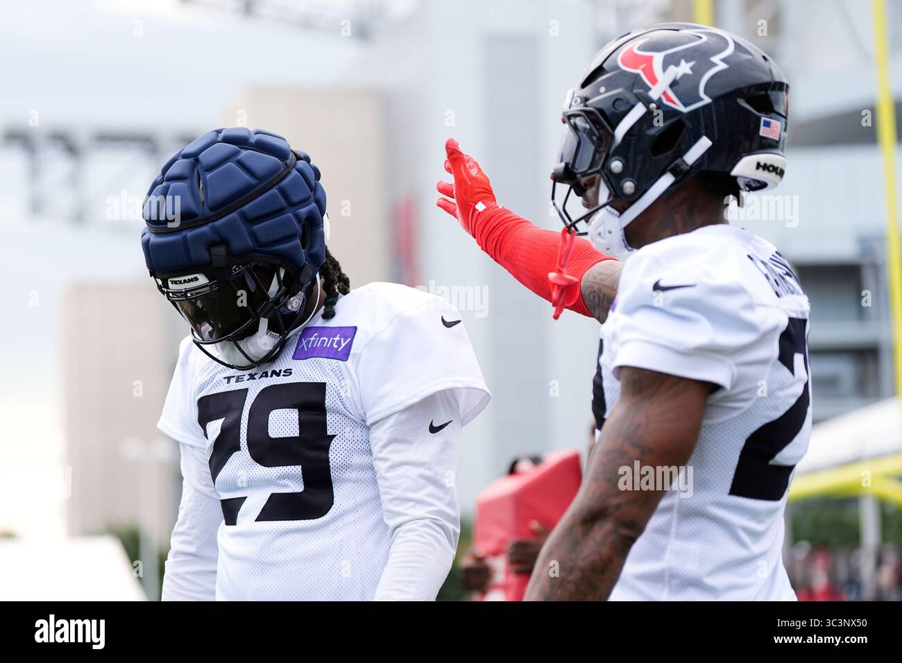 Houston Texans safety C.J. Gardner-Johnson, right, greets safety M.J ...