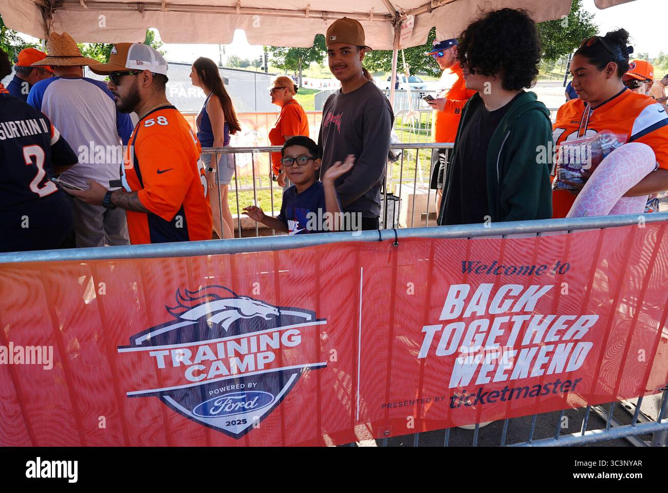 Fans move into the viewing area for the Denver Broncos practice during Back Together Weekend at ...