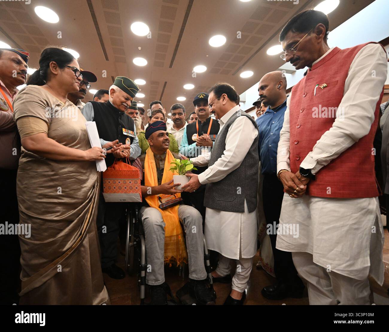 NEW DELHI, INDIA - JULY 26: BJP National President JP. Nadda honored a soldier Sanjeev Kumar ...