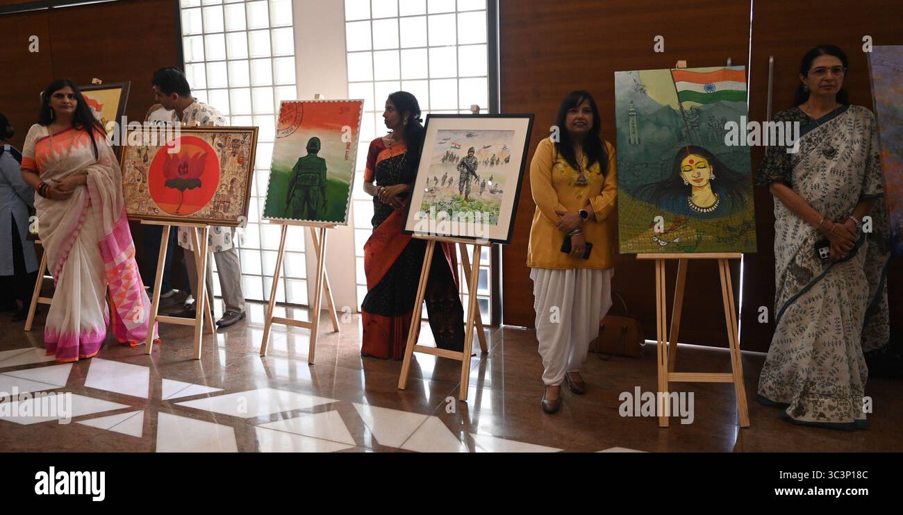 NEW DELHI, INDIA - JULY 26: Artists with their paintings during the ...