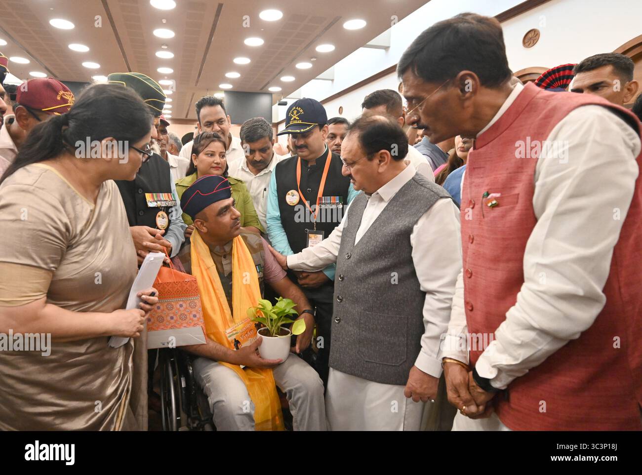 NEW DELHI, INDIA - JULY 26: BJP National President JP. Nadda honored a soldier Sanjeev Kumar ...