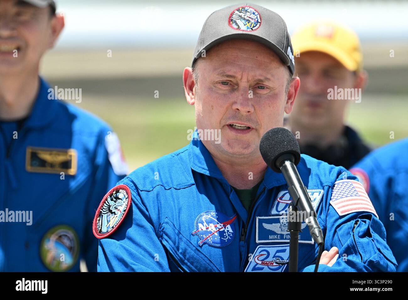 NASA Crew 11 Pilot Mike Finke speaks to the media after arriving at the ...