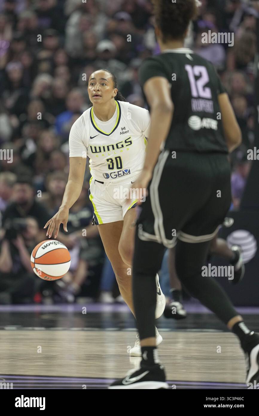 Dallas Wings guard Haley Jones (30) dribbles up court against Golden ...