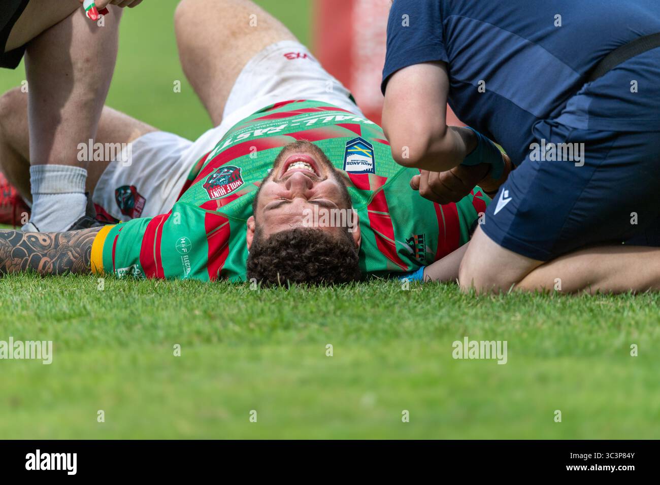 Men rugby player receiving first aid treatment in an amateur Rugby ...