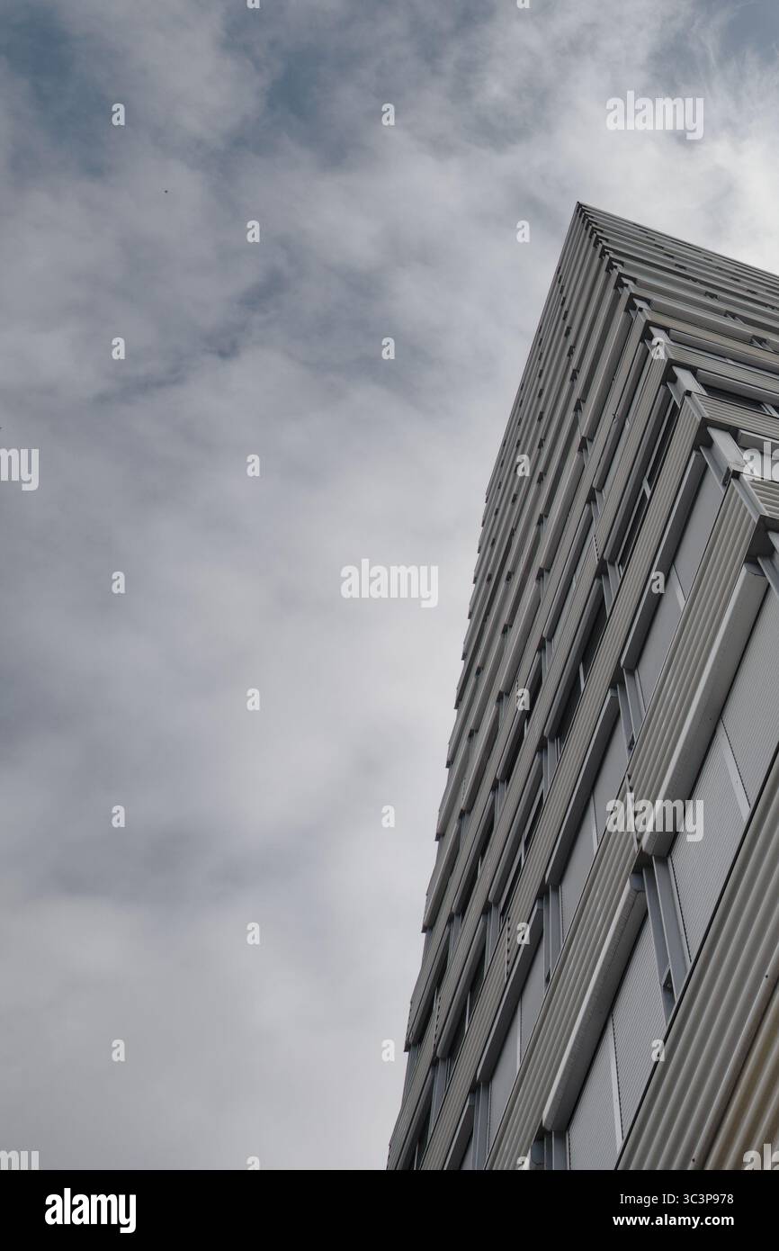 Modern residential building shot from a low angle, accentuating its ...