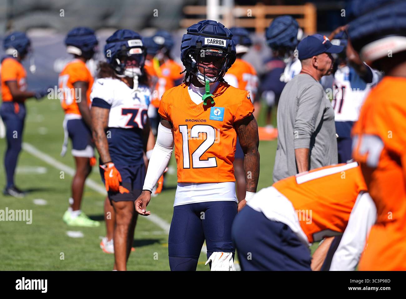 Denver Broncos cornerback Jahdae Barron (12) warms up during Back ...