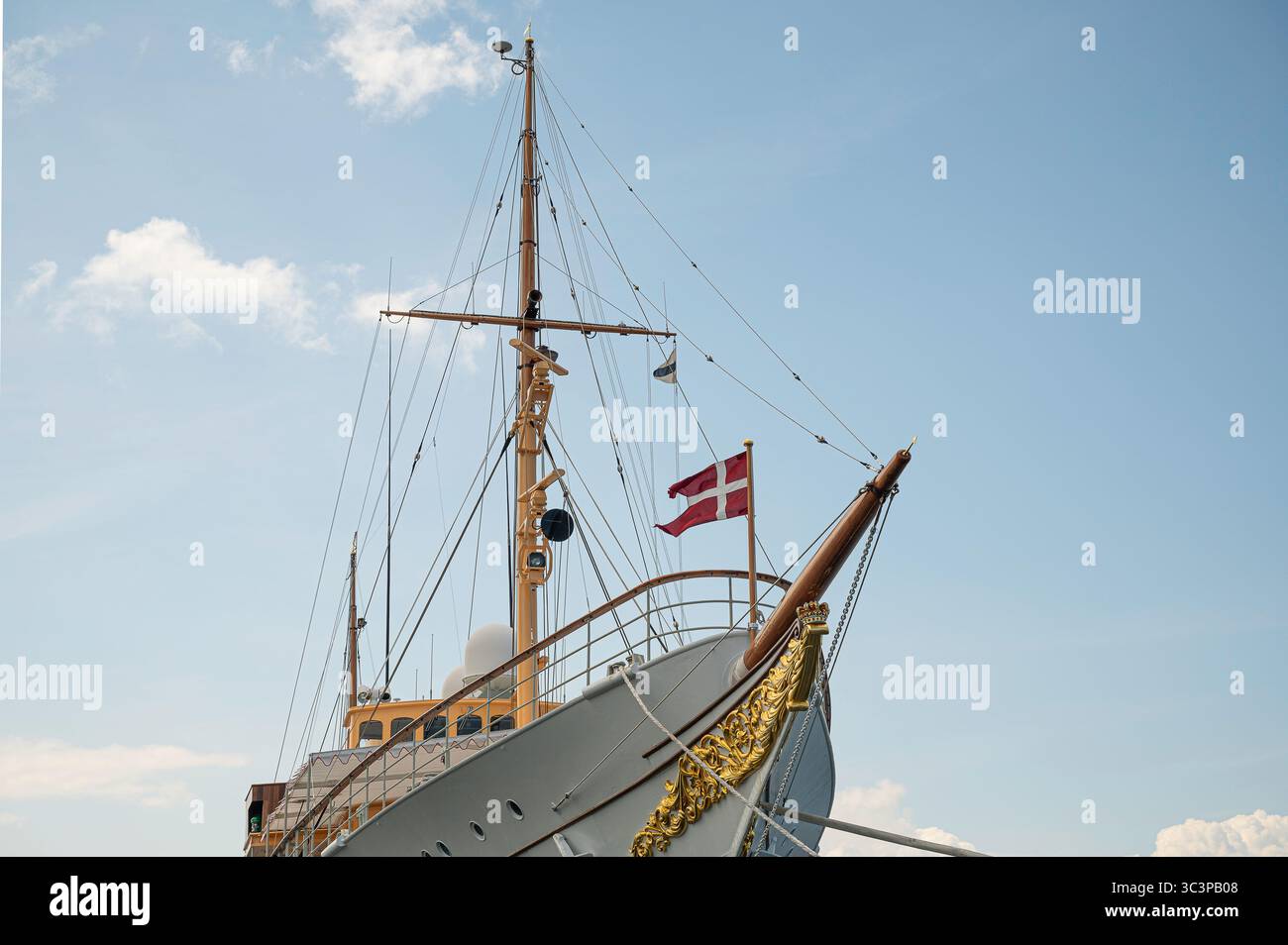 the royal danish ship Dannebrog against a blue sky in the harbour of ...