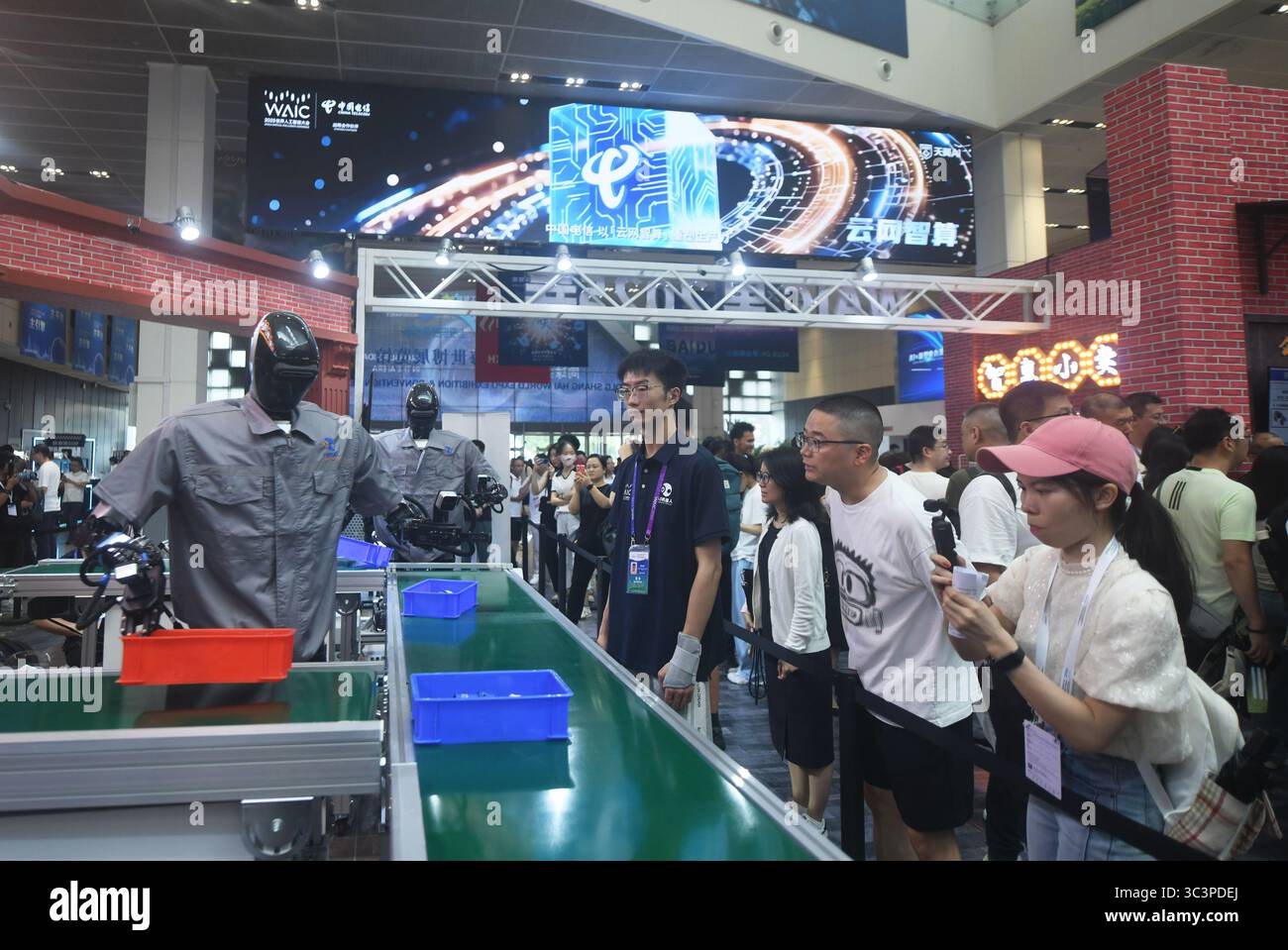 SHANGHAI, CHINA - JULY 26, 2025 - Audience watched a demonstration of humanoid robots sorting ...
