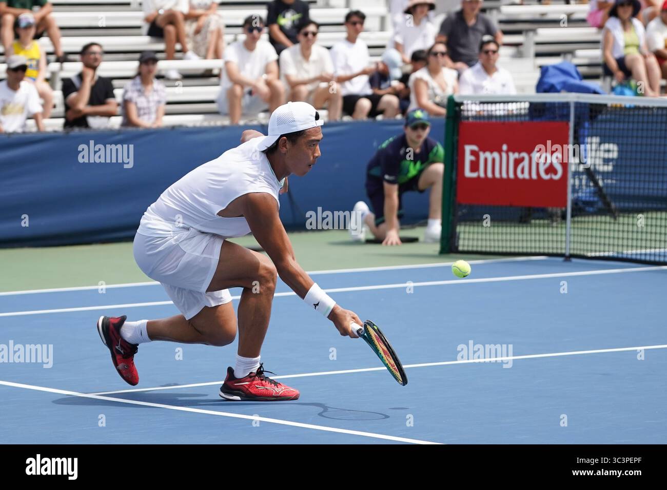 Li Tu of Australia plays a forehand against Pierre-Hugues Herbert of ...